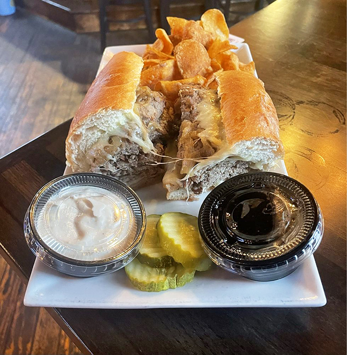 A cheesesteak that's having an identity crisis as a French dip—and we're here for it. The twin dipping sauces create a choose-your-own-adventure for your taste buds.