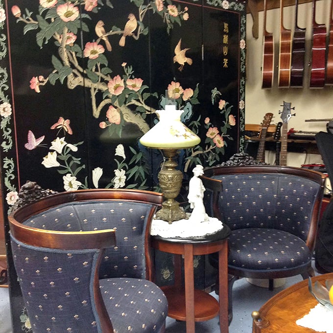 Not just furniture, but a complete Victorian conversation corner. That Asian-inspired screen could tell tales of proper parlor gossip.