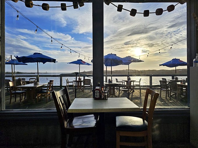 Dining with a view that makes you wonder why you ever eat indoors. Those string lights aren't decoration—they're setting the stage for seafood theater.