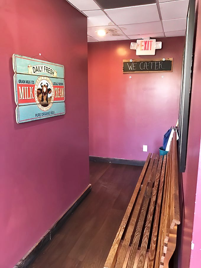 Even the waiting area tells a story—pink walls, vintage signs, and a wooden bench that's hosted countless hungry patrons dreaming of pancakes.