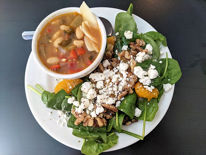 A bowl of goodness paired with a salad that actually looks like someone cared. That feta sprinkle is the jewelry this dish deserves.