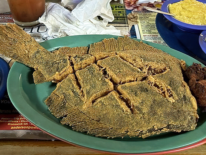 This whole flounder isn't just dinner—it's performance art. The fish equivalent of "go big or go home" presented on a humble plate.