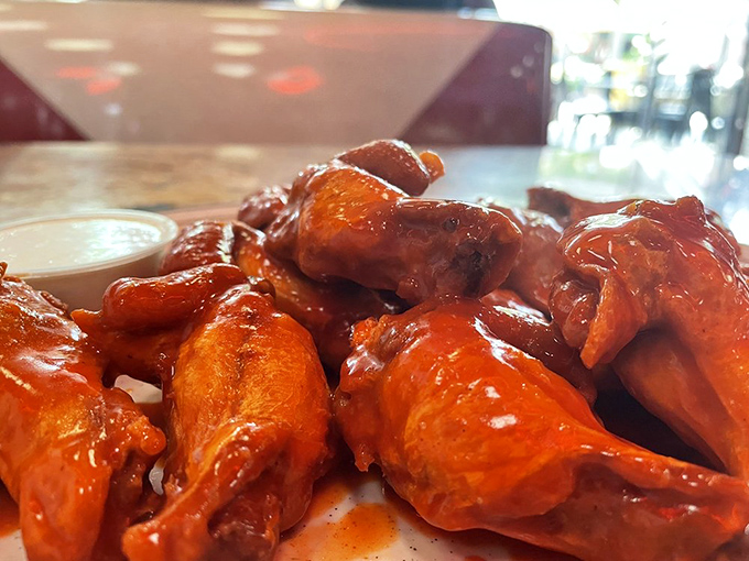 Buffalo wings glistening with sauce that promises a delicious kick. These aren't just appetizers—they're the reason napkin dispensers were invented.