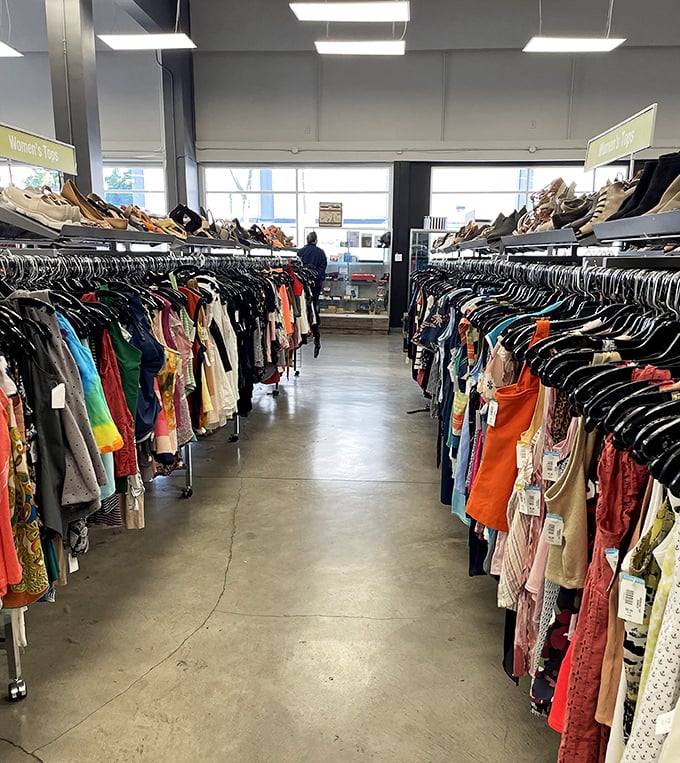 A kaleidoscope of colors lines this aisle, where women's tops of every hue stand ready for their next outing, whether to a café or corner office.