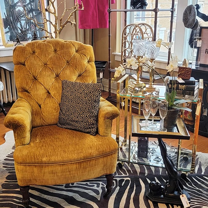 That mustard velvet chair isn't just seating—it's a throne waiting for someone to recognize its royal potential in a modern living room.