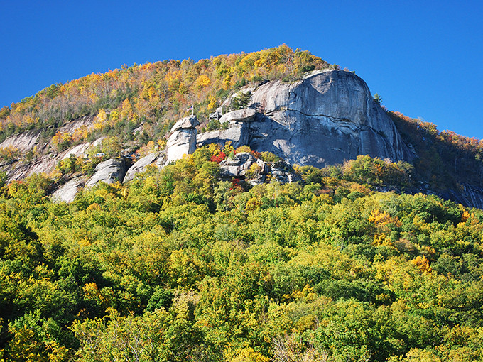 Granite cliffs draped in autumn finery – where every tree seems to be competing in nature's version of "Who Wore It Best?"