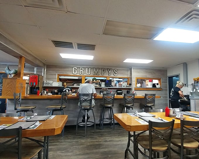 The counter seats—where breakfast aficionados gather to watch culinary magic unfold. Prime real estate for solo diners and coffee philosophers.