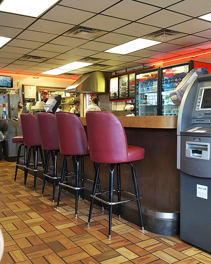 The counter seats – where regulars perch like birds on a wire, exchanging local gossip while watching sandwich magic unfold.