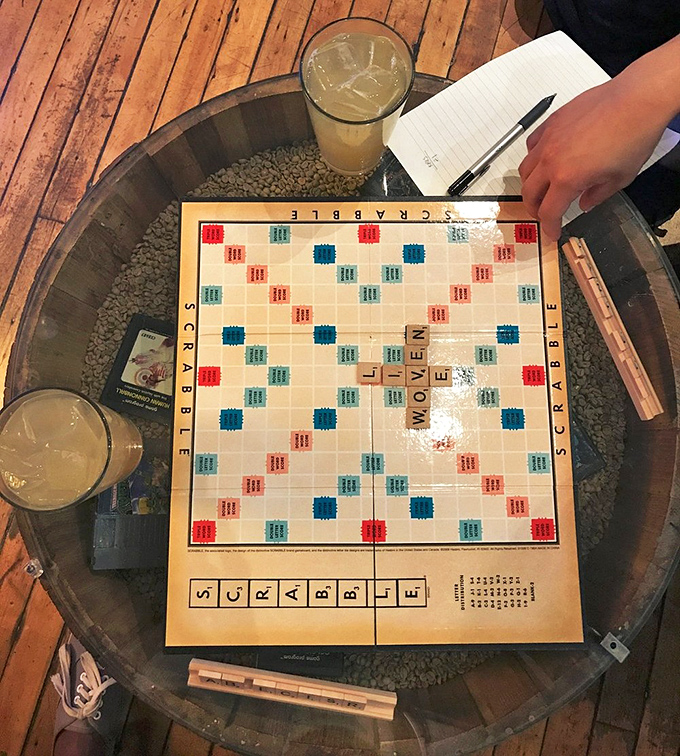 Scrabble and cold brew—proof that some of life's greatest pleasures don't require batteries or Wi-Fi. Though "WORMHOLE" would score you a hefty 19 points.