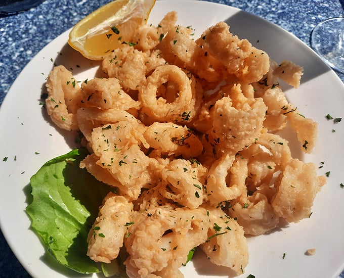 These calamari aren't just fried—they're transformed into crispy, golden halos that make you forget you're eating something that once swam in the ocean.