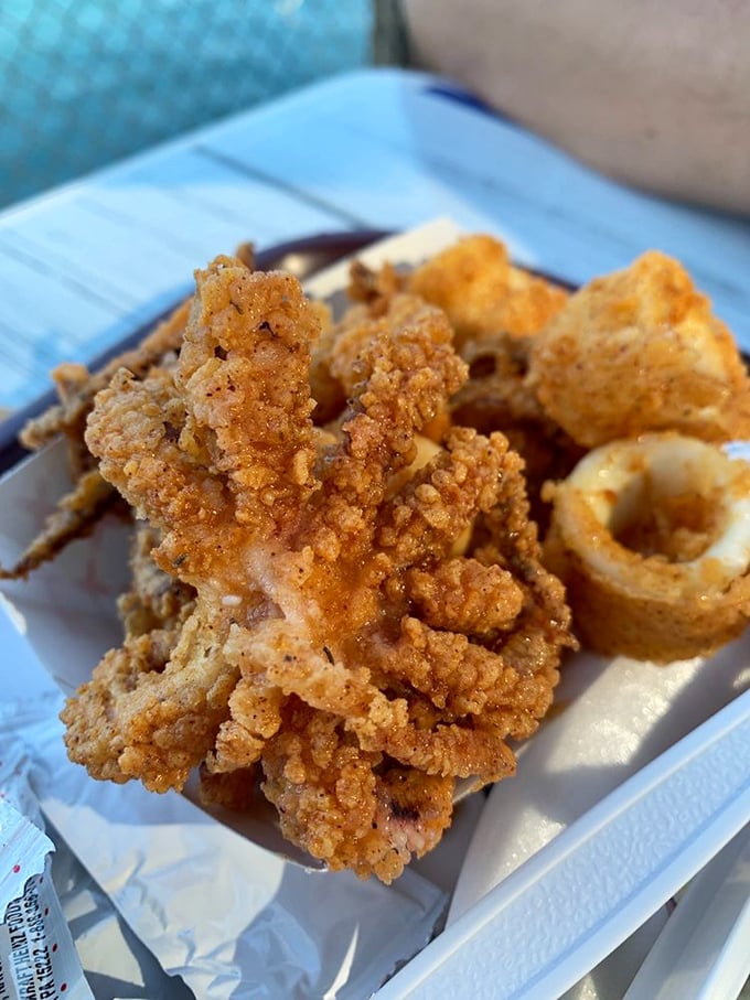 Golden calamari rings that crunch like autumn leaves. The perfect balance of tender and crisp—ocean meets fryer in perfect harmony.