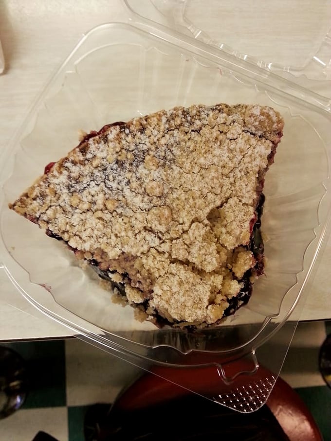 This isn't just cobbler—it's someone's grandmother's recipe that somehow found its way to paradise, crumble topping and all.