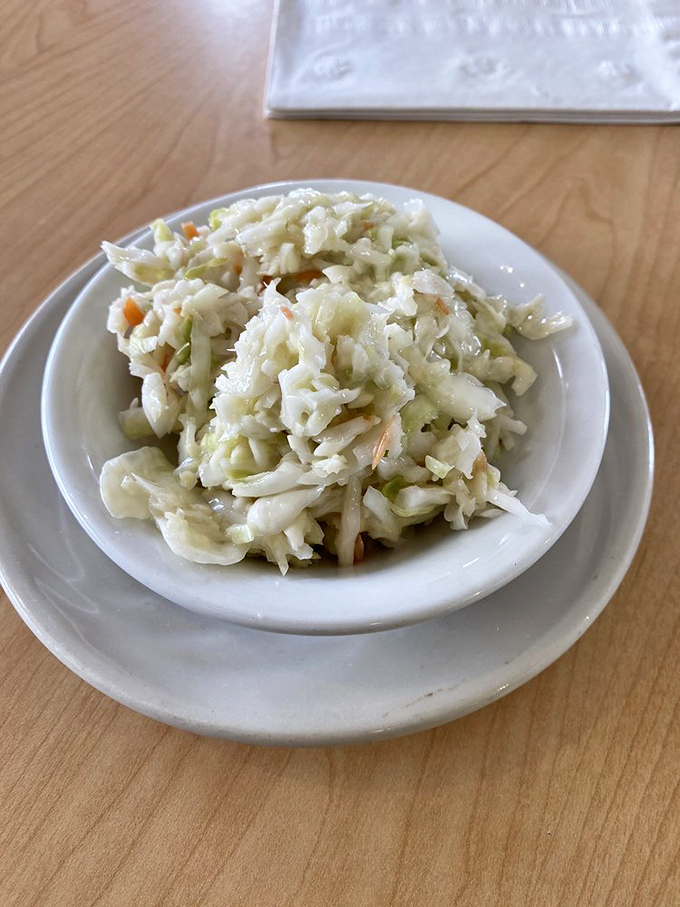 Coleslaw this fresh and crisp isn't just a side dish—it's the supporting actor that deserves its own Academy Award for balancing out all that delicious richness.