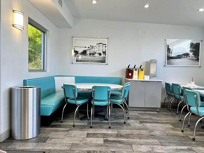 Corner booth seating with vintage photos creates the perfect spot for lingering over great food.