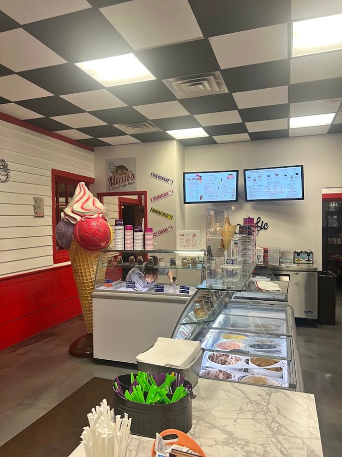 The service counter at Mimi's—where dreams come true and diets go to die, all under that playful ice cream cone wall art.