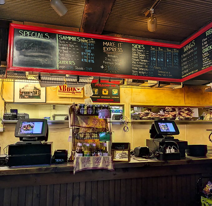 Where barbecue dreams come true – the ordering counter with its handwritten specials board promises smoky treasures just moments away.