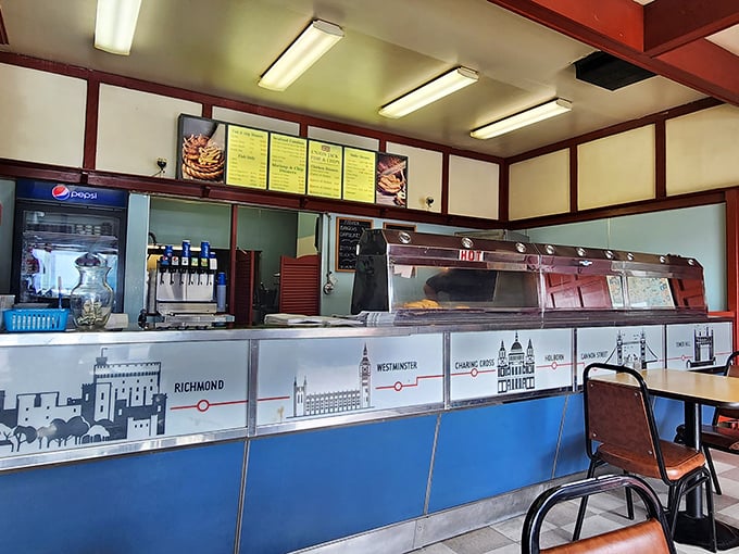 The counter where magic happens—a London Underground map guides you through British culinary stations. The hot lamps keep the treasures warm until they reach your table.
