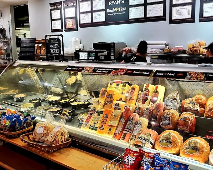The deli counter gleams with possibilities—cheeses, meats, and breads waiting to become memories you'll be talking about for weeks.