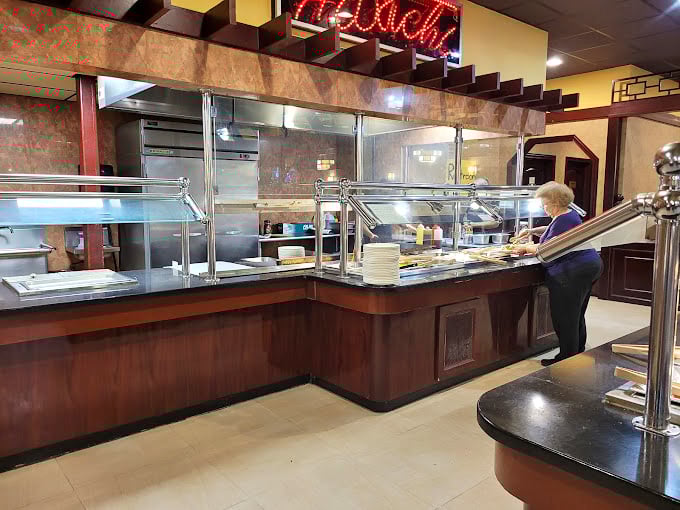 The buffet station stands ready for action, its "Ranch" sign glowing like a beacon for Midwesterners who consider it the fifth food group.