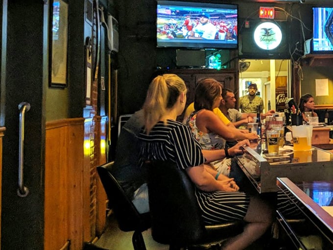 The bar at Clover Club—where strangers become friends, friends become family, and everyone becomes an expert sports commentator after the second beer.