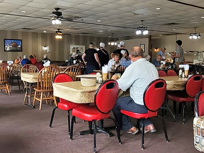 A dining room where strangers become neighbors and calories don't count. Notice the conspicuous absence of smartphones – conversation is the appetizer here.