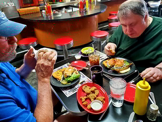 Counter dining at its finest – where strangers become temporary food companions united by the universal language of "mmm" and "pass the ketchup."