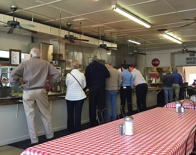 The cafeteria line – where strangers become neighbors and important decisions about mac and cheese versus collard greens are contemplated daily.