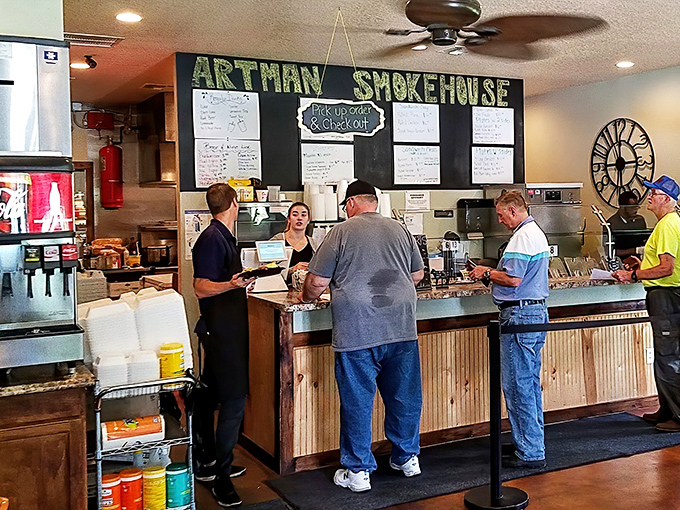 The counter service setup where barbecue dreams begin. Notice nobody's looking at their phones—all eyes on the prize.