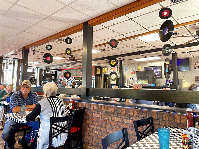 Vinyl records hanging from the ceiling create a nostalgic backdrop – because good food, like good music, never goes out of style.