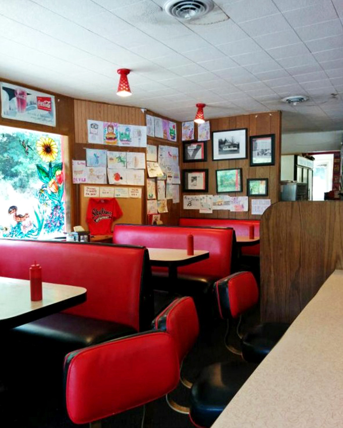Red vinyl booths and wood paneling—the classic diner formula that never goes out of style. Nostalgia you can actually sit in.