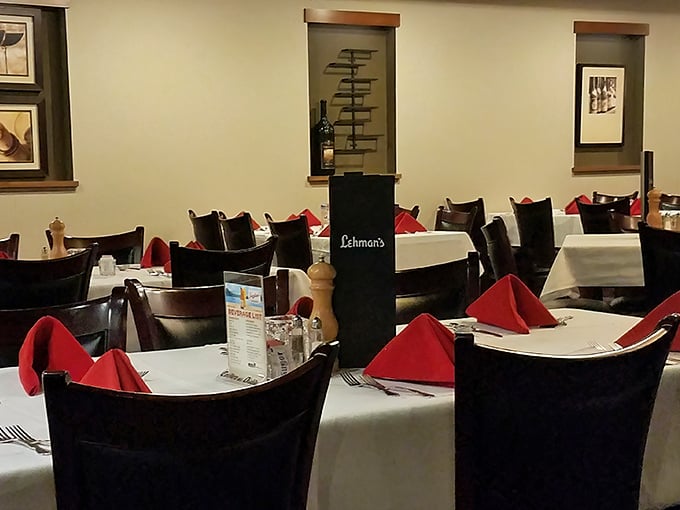 White tablecloths, dark wood chairs, and crimson napkins – the supper club trifecta that says "tonight's dinner is an occasion, not just refueling."