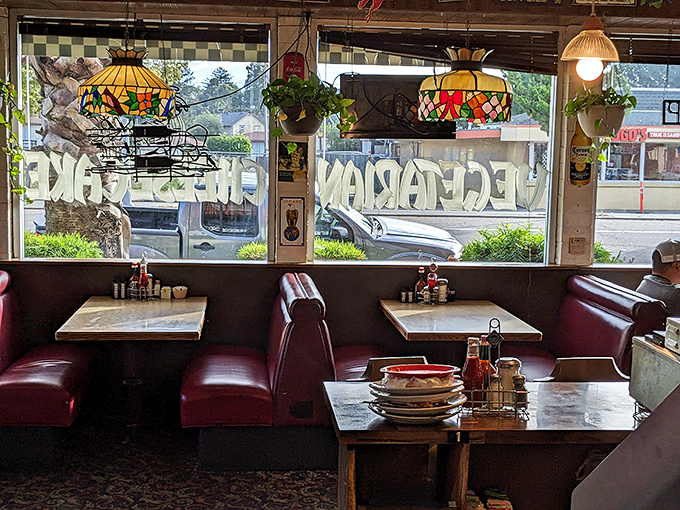 Classic diner booths where countless first dates, family celebrations, and morning-after recoveries have unfolded. Those Tiffany lamps have seen it all.