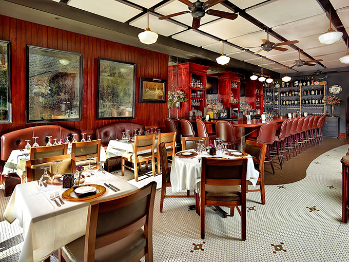 The bar and dining area perfectly balances old-world charm with contemporary comfort – like a well-tailored suit that fits just right.
