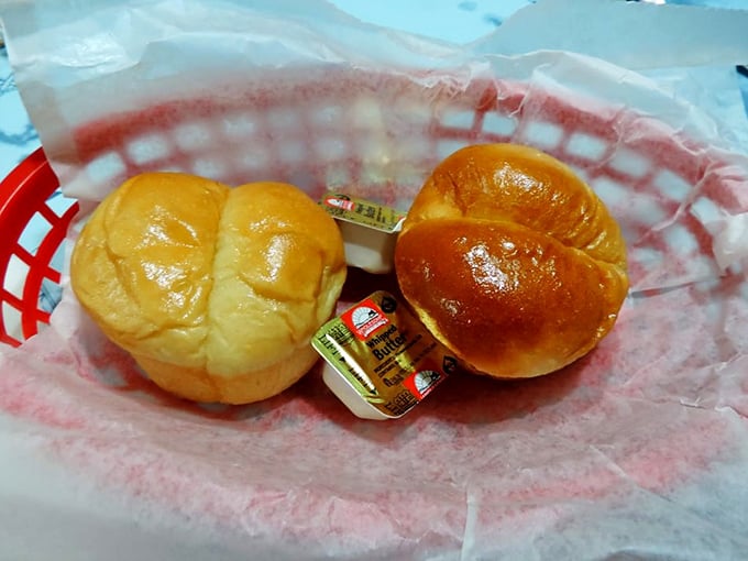 Fresh dinner rolls with butter pats—the opening act that sets the stage for seafood stardom. Simple pleasures are often the most satisfying.