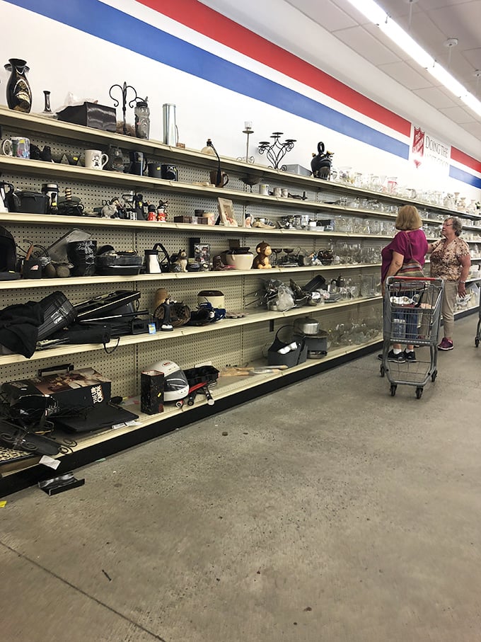Kitchen treasures await new homes. Those shelves hold everything from everyday mugs to the perfect replacement for that serving dish your cousin accidentally broke.