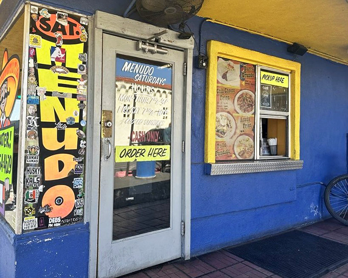 The humble entrance that leads to extraordinary flavors, where "Order Here" means culinary adventure awaits.