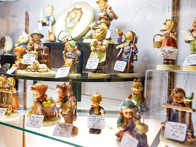 Hummel figurines stand in silent formation, ready to march from this glass shelf straight into your curio cabinet and your grandmother's heart. 