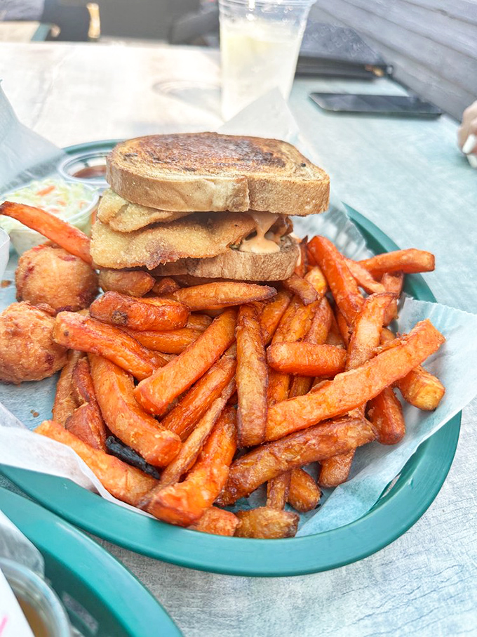 This sandwich and sweet potato fries combo isn't just lunch—it's a vacation on a plate. The kind of meal that makes you forget to check your phone.