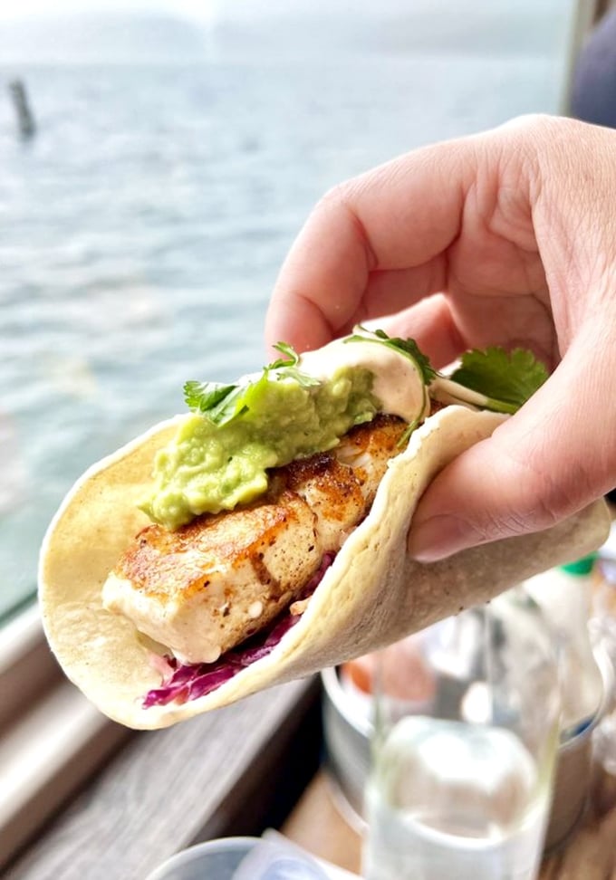 This fish taco isn't just food—it's edible architecture where crispy fish, creamy avocado, and tangy slaw create the perfect handheld masterpiece.