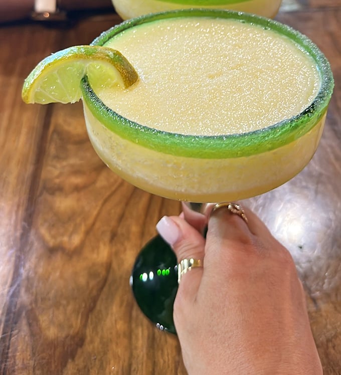 A margarita with the perfect salt rim—like Florida sunshine in a glass, complete with that lime wedge you'll squeeze with childlike delight.