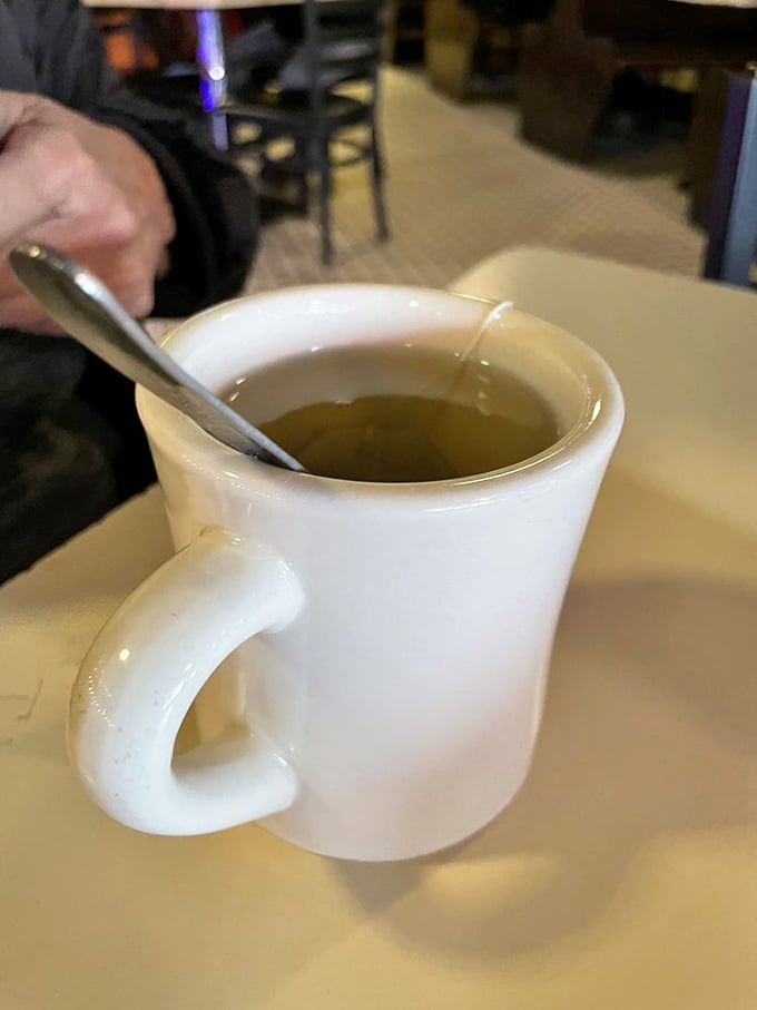 Sometimes the simplest pleasures are best—a sturdy white mug of steaming tea, ready to warm both hands and spirits.