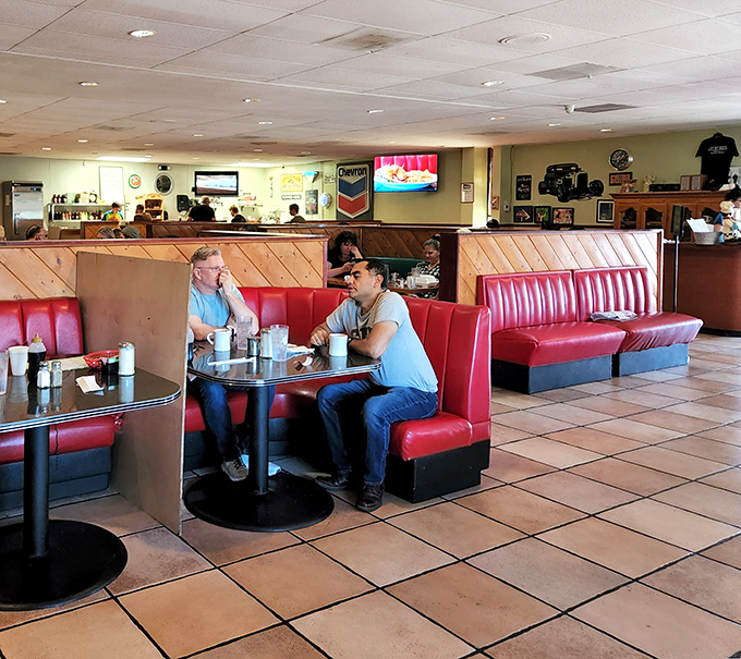The red booths aren't just comfortable—they're front-row seats to the greatest show on earth: breakfast in America.