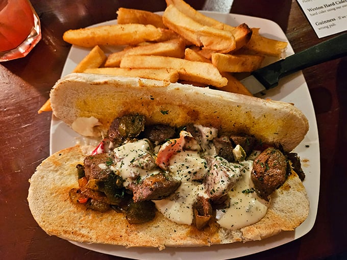 This sandwich isn't messing around – loaded with savory morsels and creamy sauce, it's the kind of meal that requires both hands and zero shame.