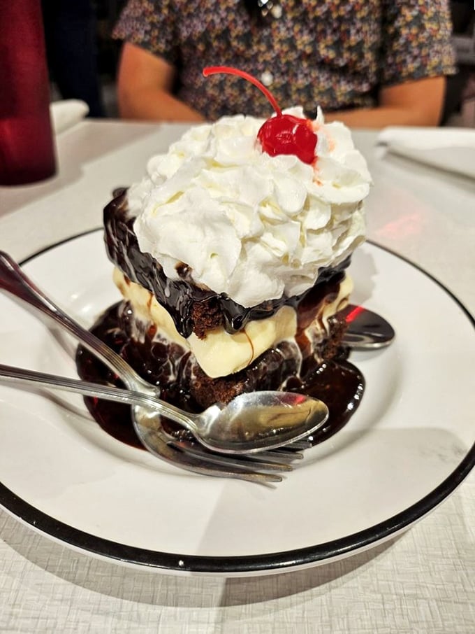 Chocolate brownie sundae so magnificent it deserves its own ZIP code—hot fudge cascading down mountains of ice cream and whipped cream.