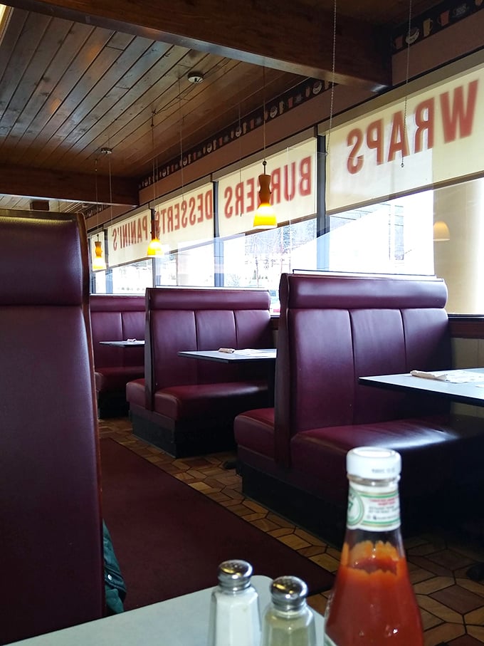 Red vinyl booths—the throne of diner royalty—line up beneath wooden ceilings, creating the perfect backdrop for solving the world's problems over coffee.