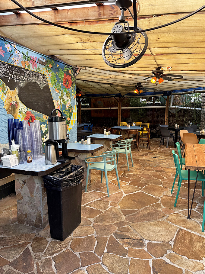 The covered patio blends rustic charm with artistic flair—exactly where you want to linger over that second cup of coffee.