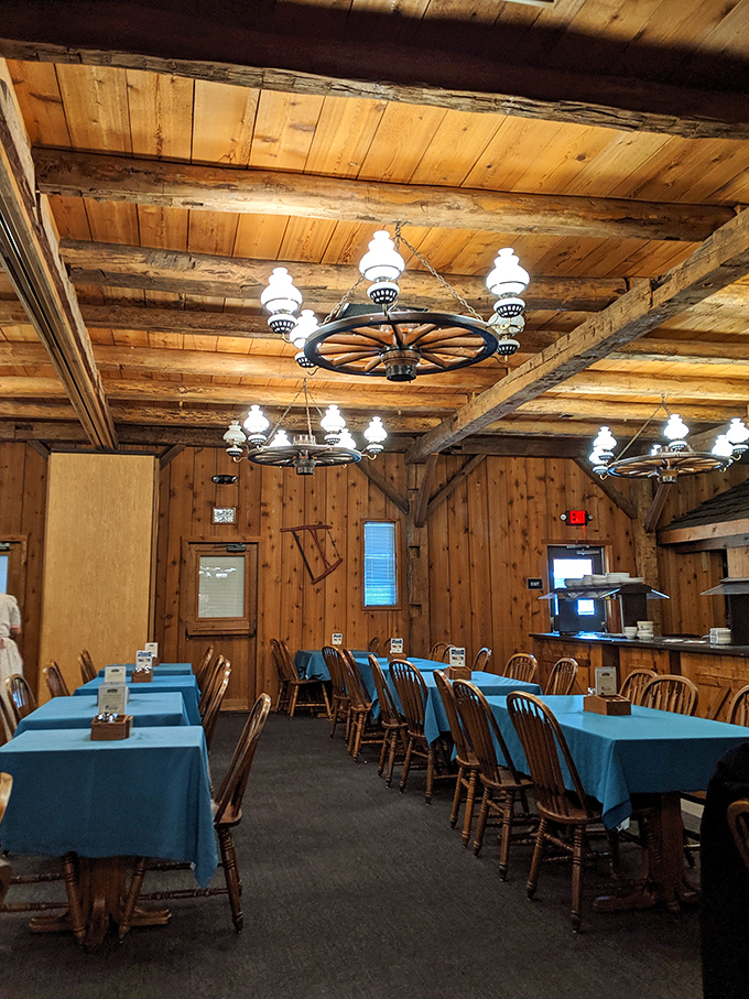 Wagon wheel chandeliers illuminate wooden walls that have witnessed decades of family celebrations. If these beams could talk, they'd tell you to order dessert.