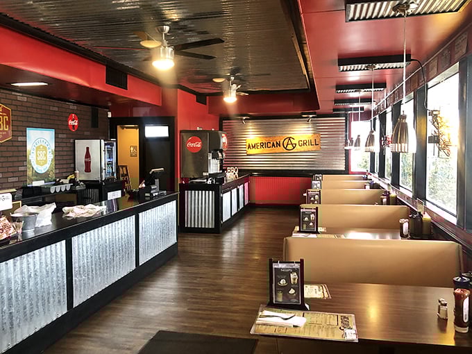 Red walls, corrugated metal, and warm wood tones—the BBQ trifecta of interior design. You know you're in the right place when the décor matches the food.