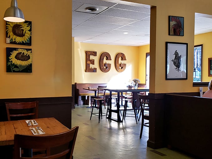The "EGG" sign isn't just decor—it's a three-letter promise of breakfast excellence that this sunny yellow room delivers on daily.