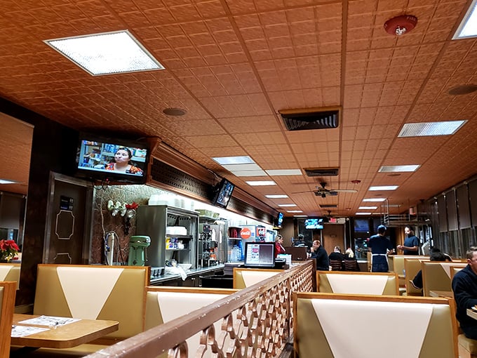 The diner's interior – where time slows down just enough to enjoy another cup of coffee. Those ceiling tiles have witnessed decades of "I'll just have one more bite."